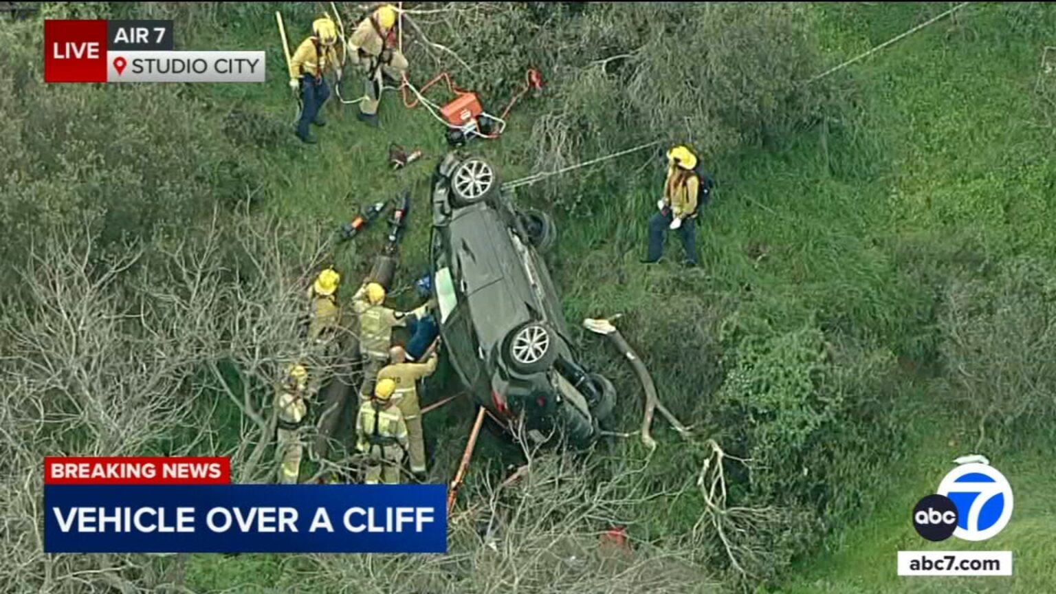 Firefighters race to rescue driver trapped in car after it veers off ...